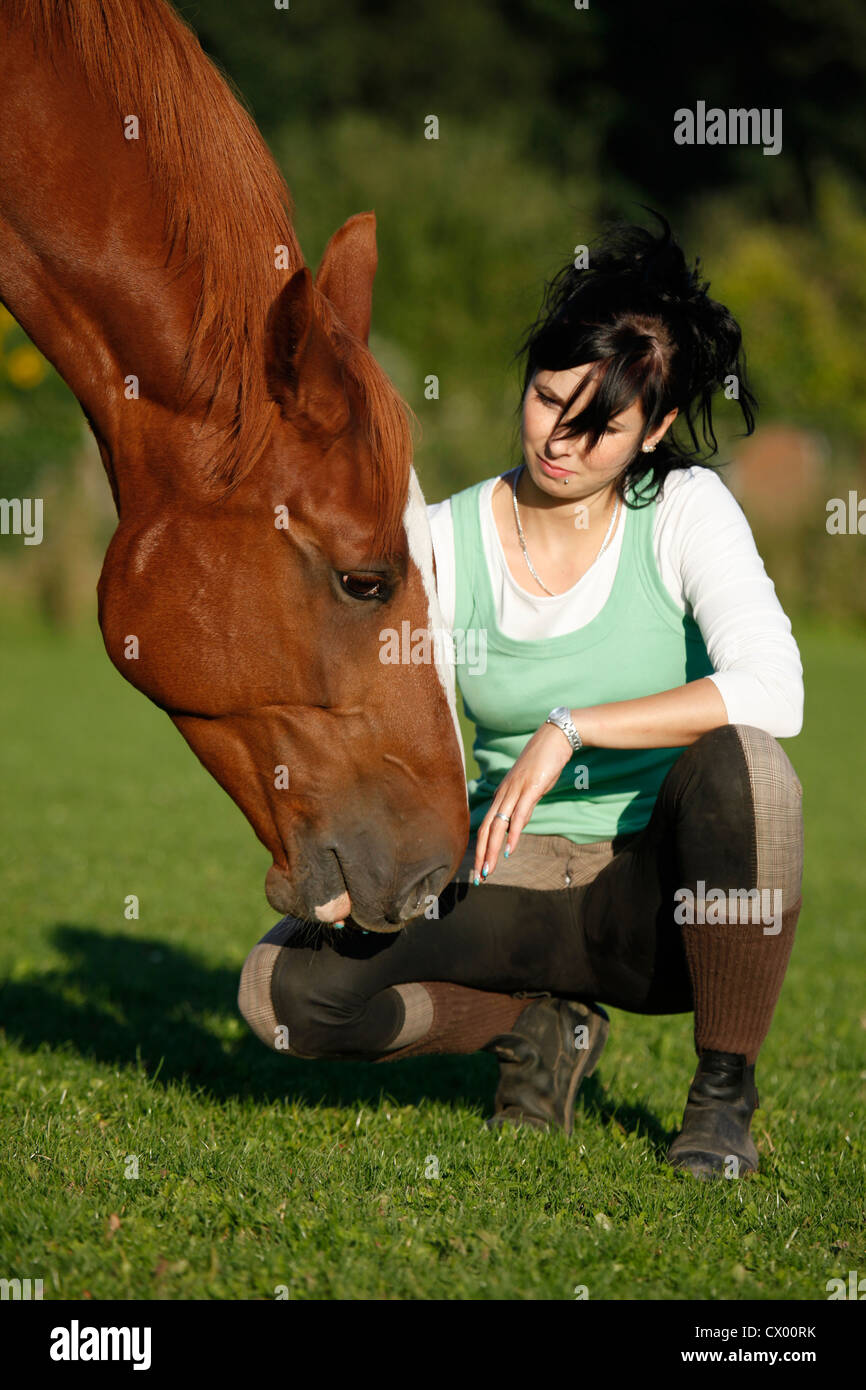 young woman with mare Stock Photo - Alamy