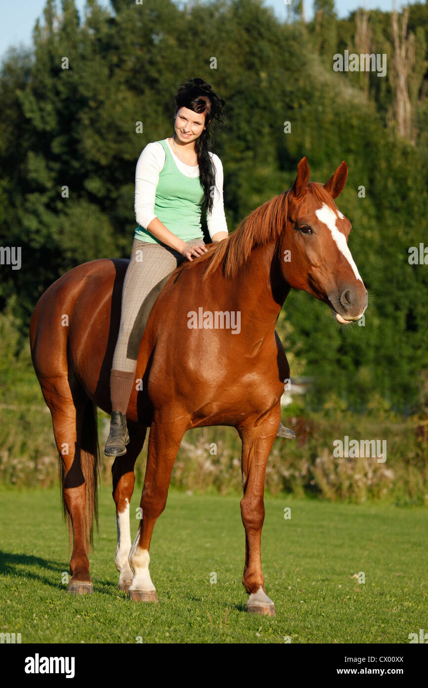 young woman with mare Stock Photo - Alamy