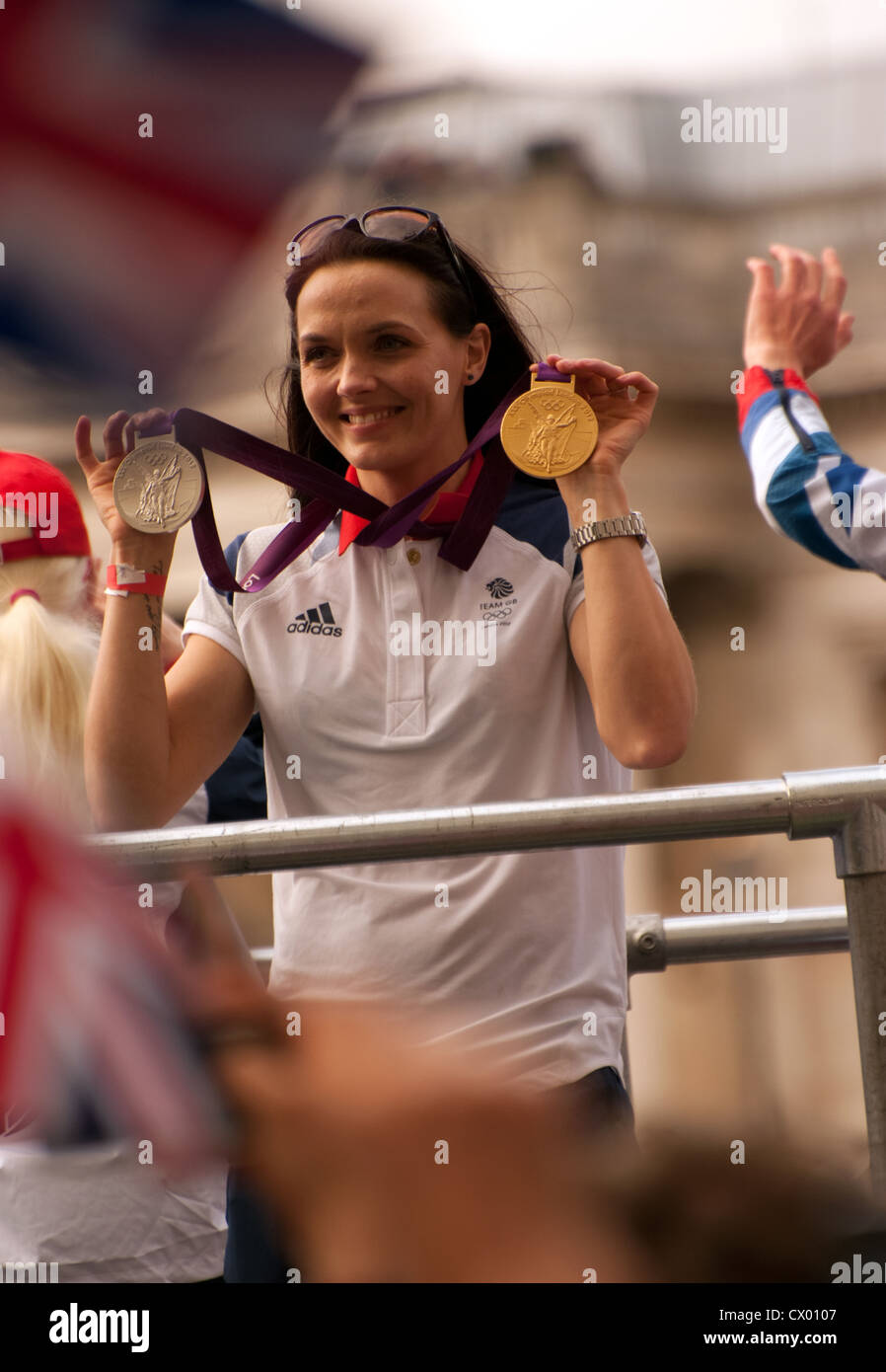 Victoria Pendleton smiles and displays her London 2012 gold and silver ...