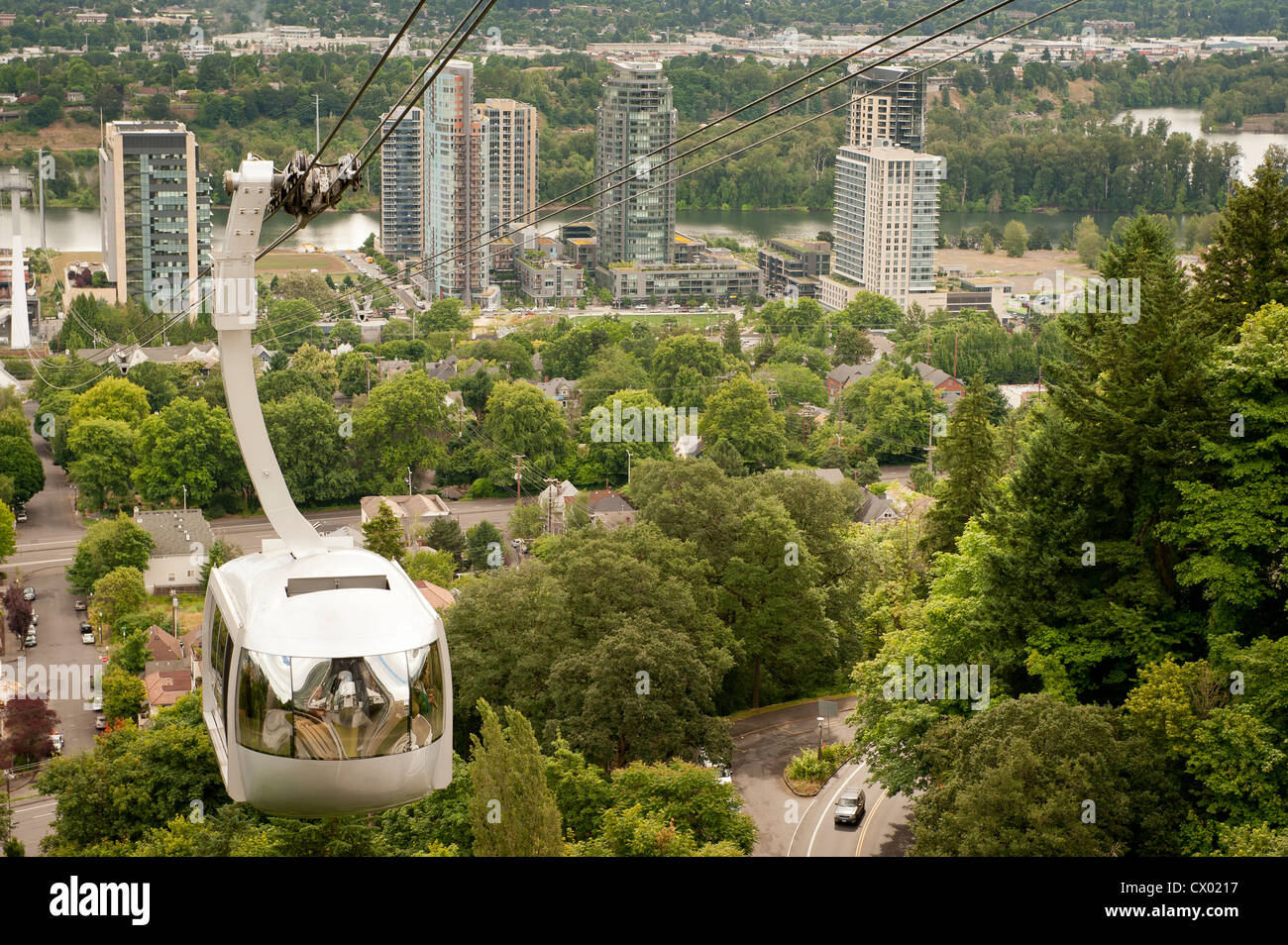An aerial tram carries commuters aloft in Portland, Oregon Stock Photo ...