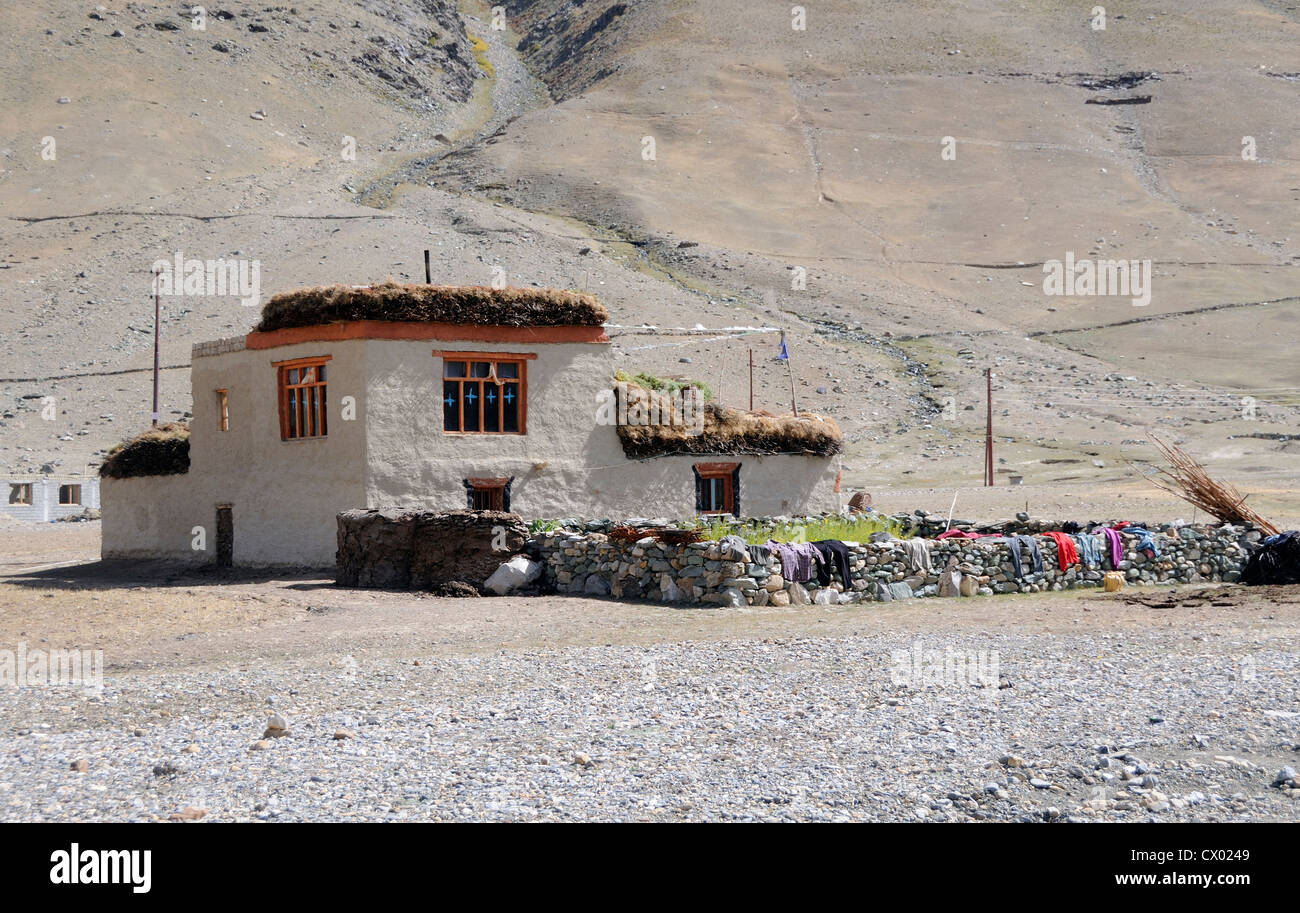 A traditional flat-roofed house in the village of Rangdum in Zanscar ...