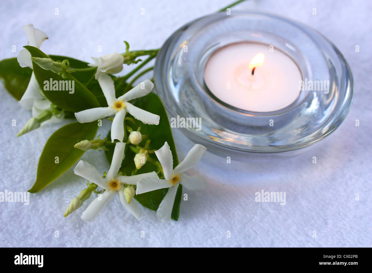 Candle with flowers in spa Stock Photo - Alamy