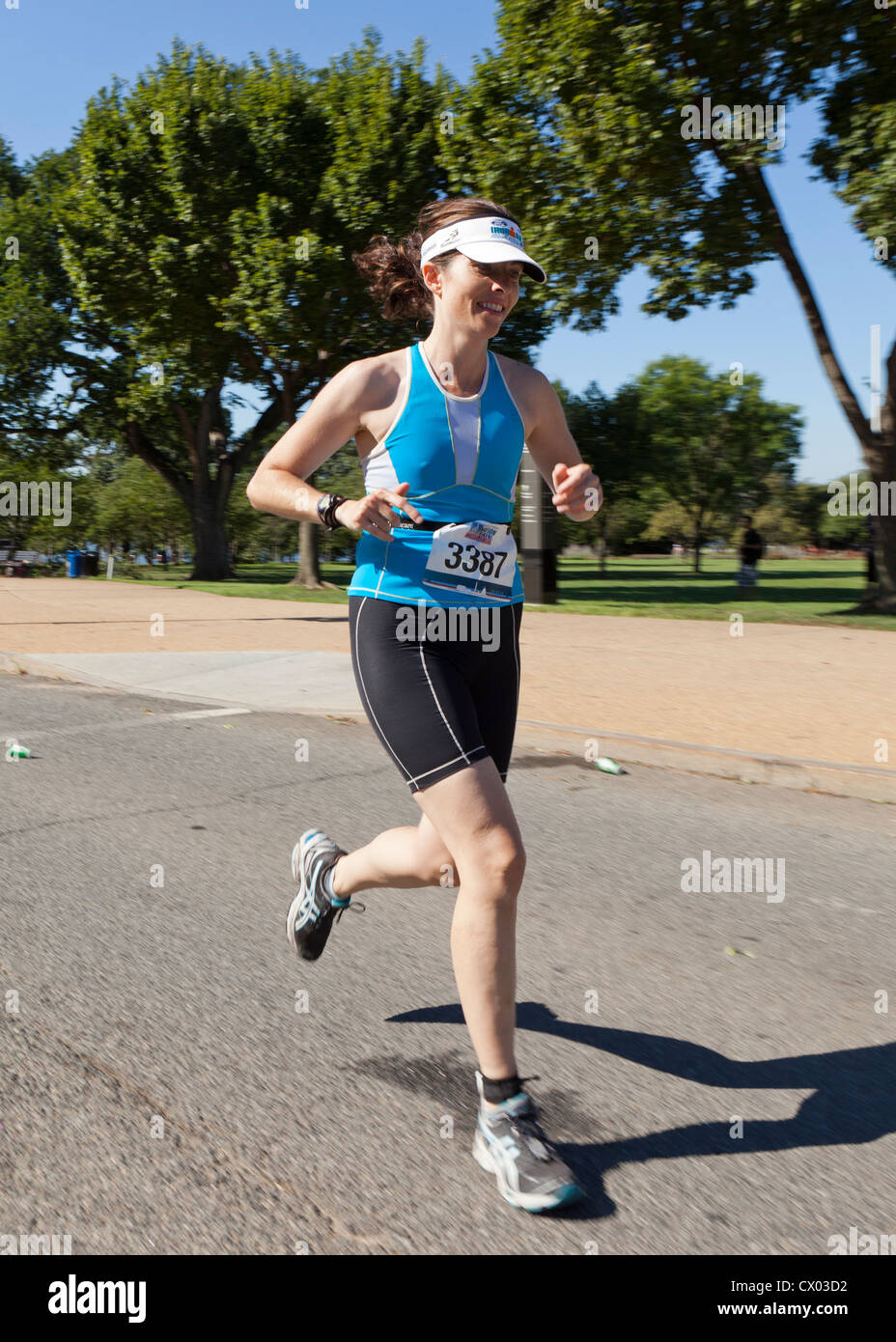 A woman running in a marathon Stock Photo - Alamy