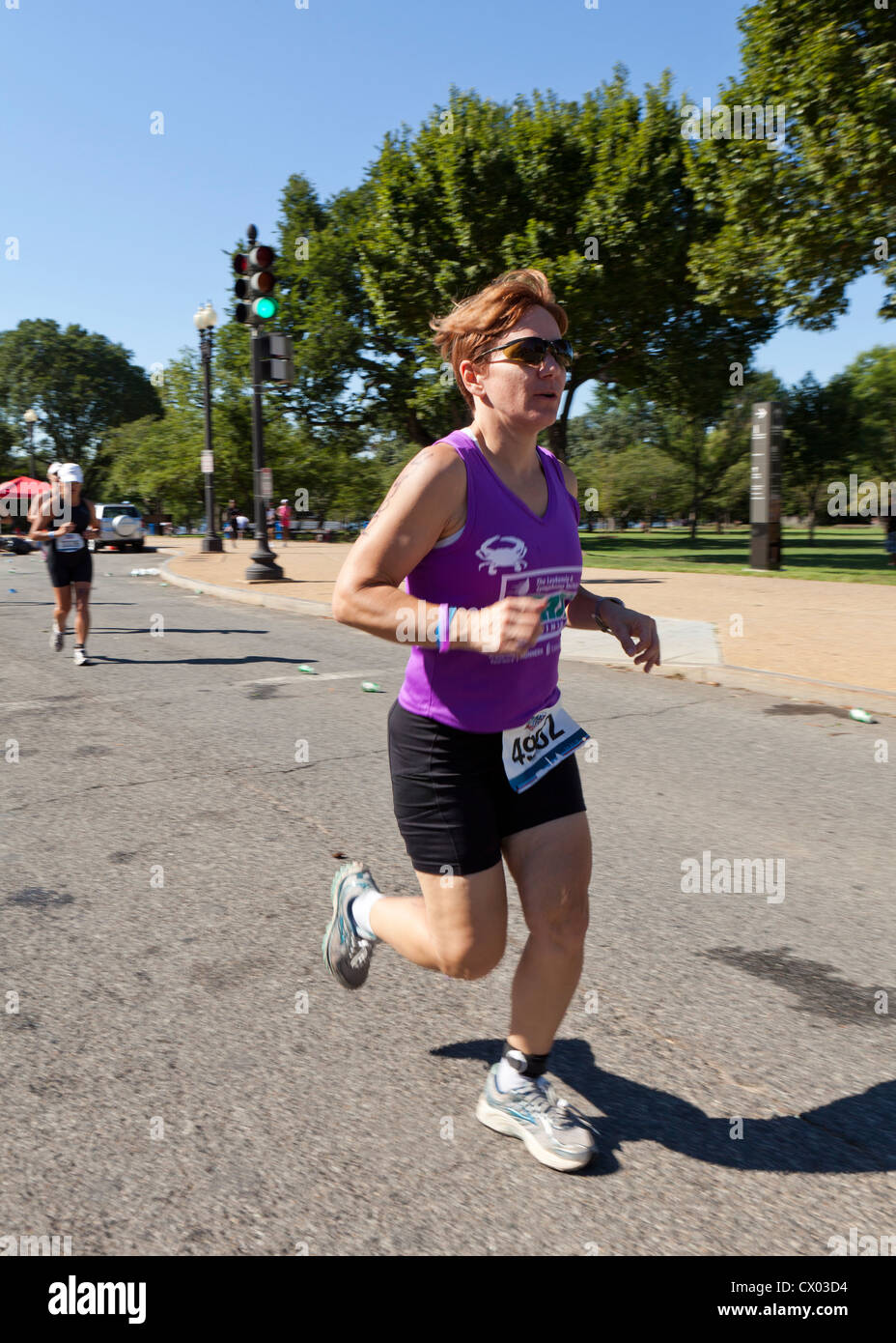 A woman running in a marathon - USA Stock Photo - Alamy