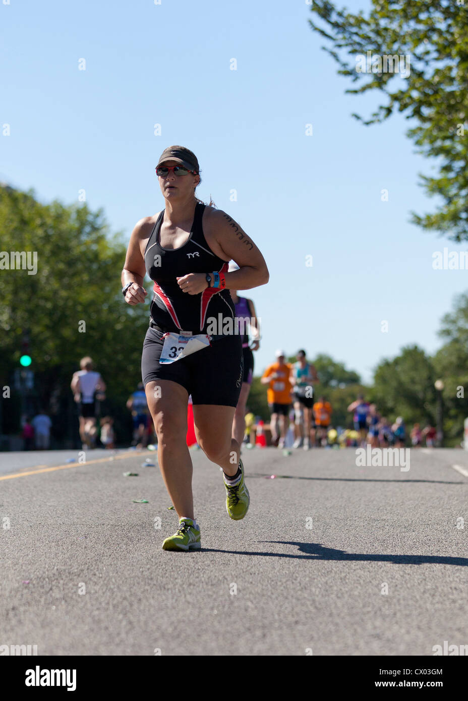 racer running in a marathon Stock Photo - Alamy