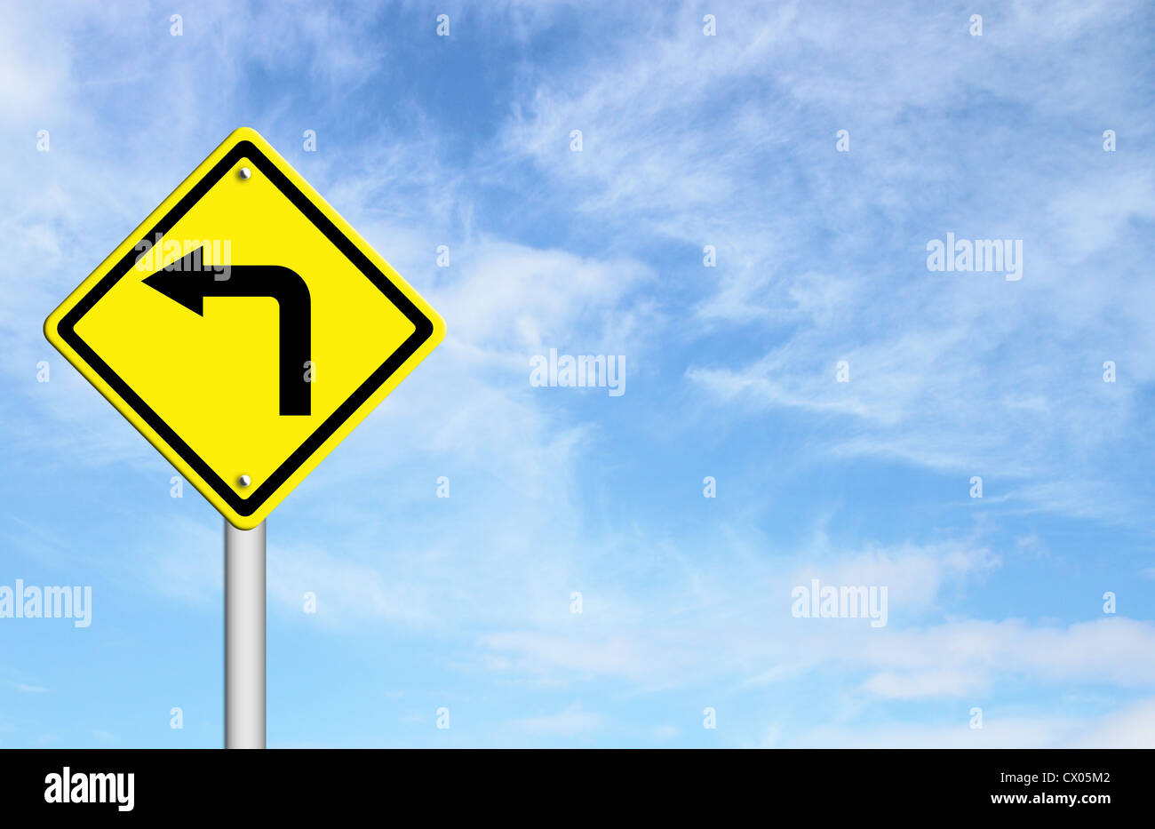 Road Sign - Left Turn Warning with blue sky blank for text Stock Photo ...
