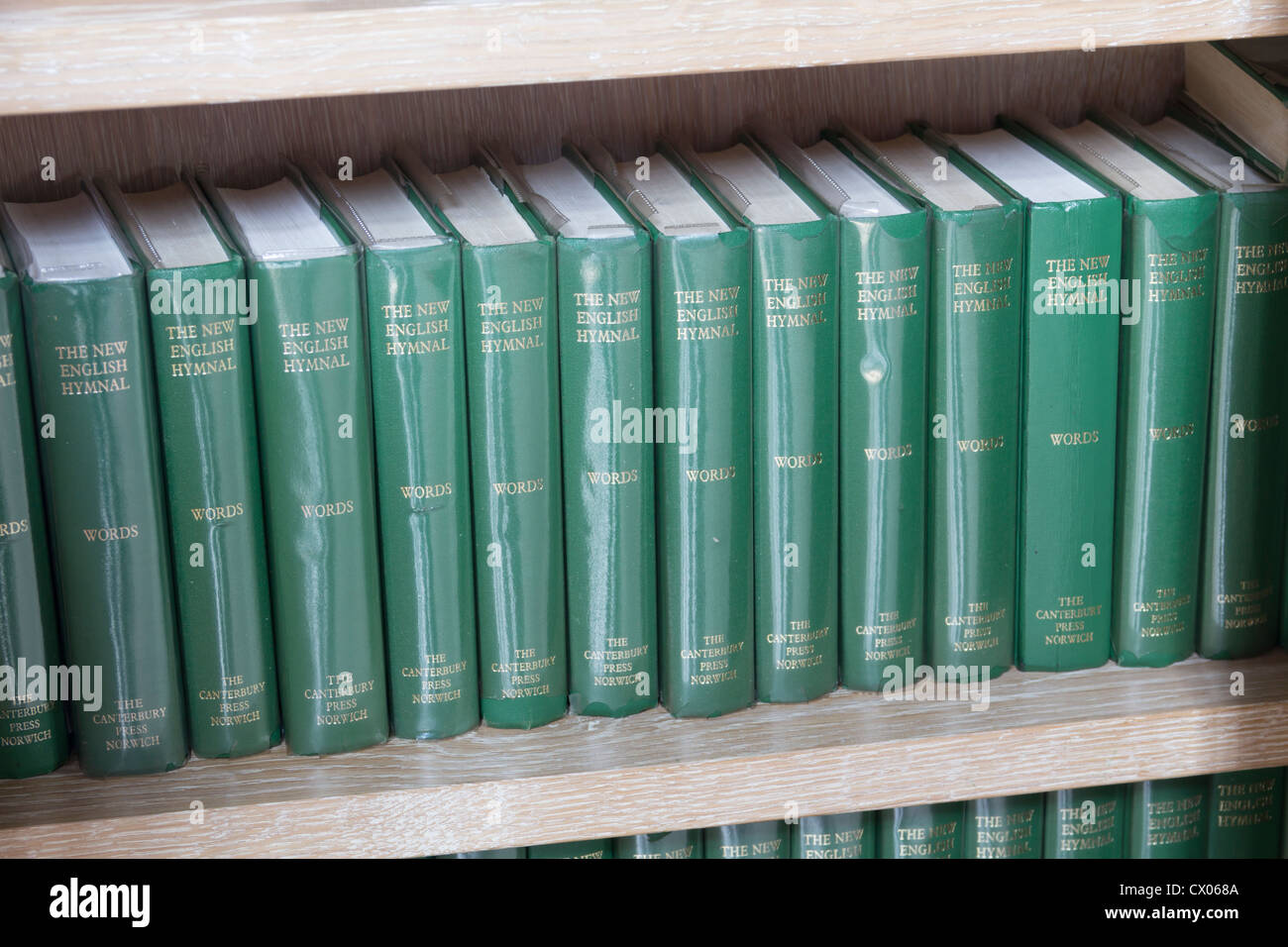 A shelf of 'The new English Hymnal', a hymnbook published in 1986 ...