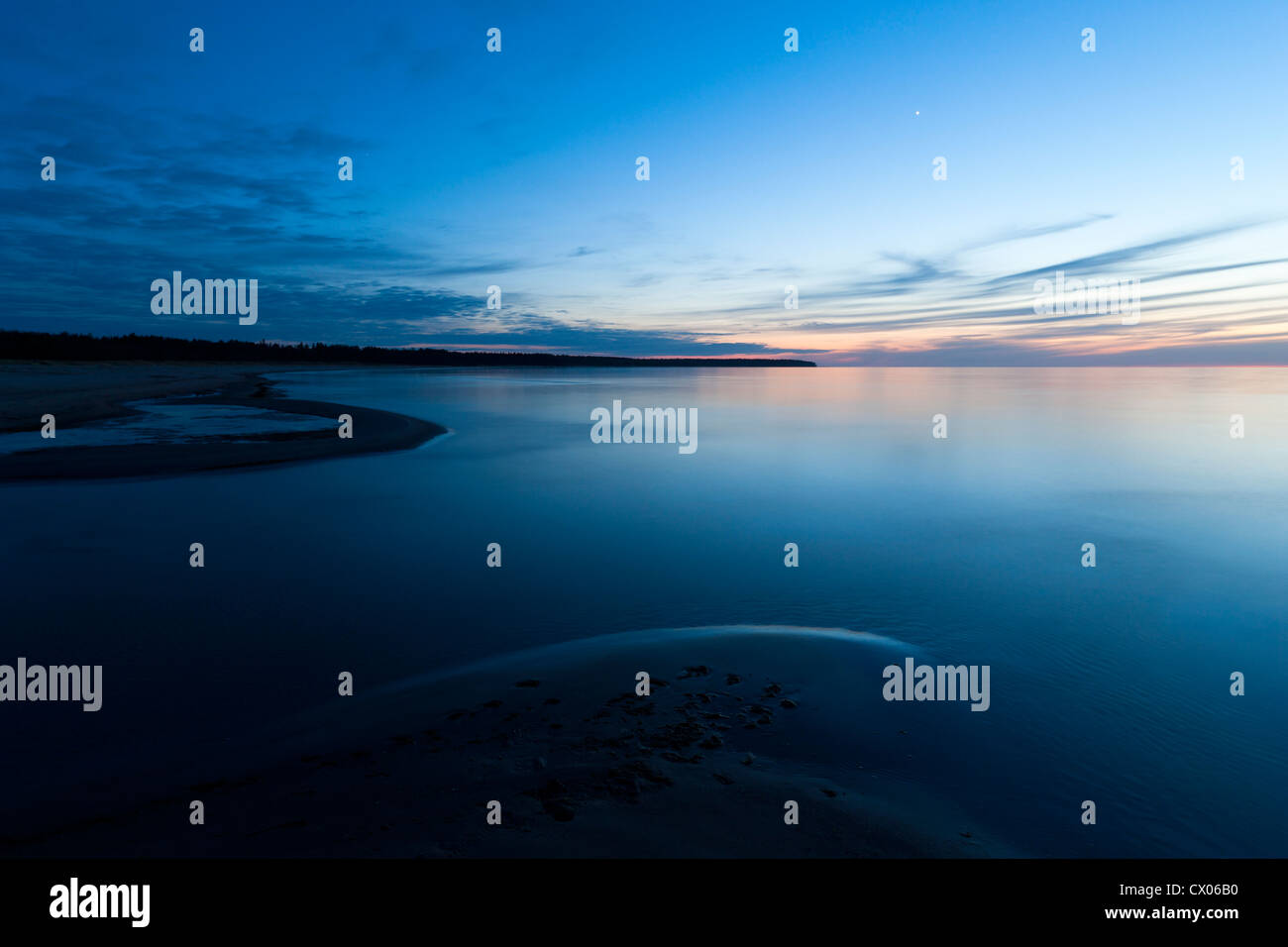 Beach after sunset Stock Photo - Alamy