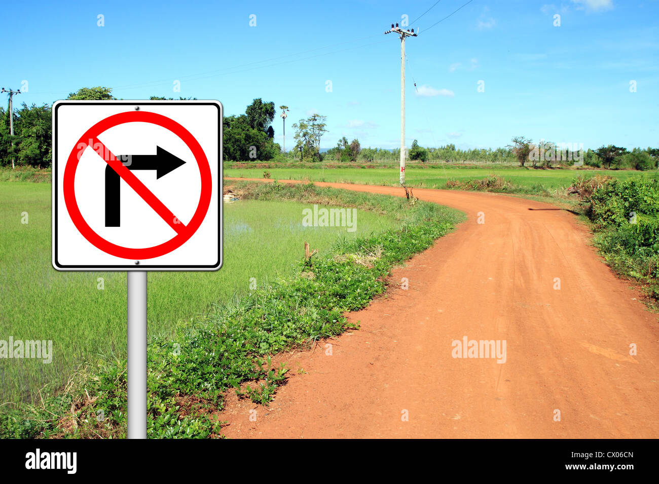 don't turn right sign with a left curved soil road background Stock ...