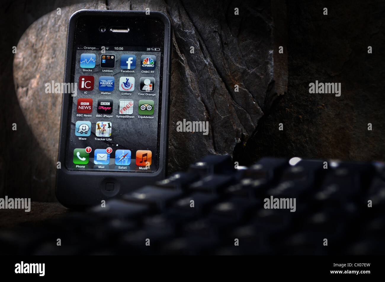 Smartphone iphone against welsh slate background with keyboard in ...