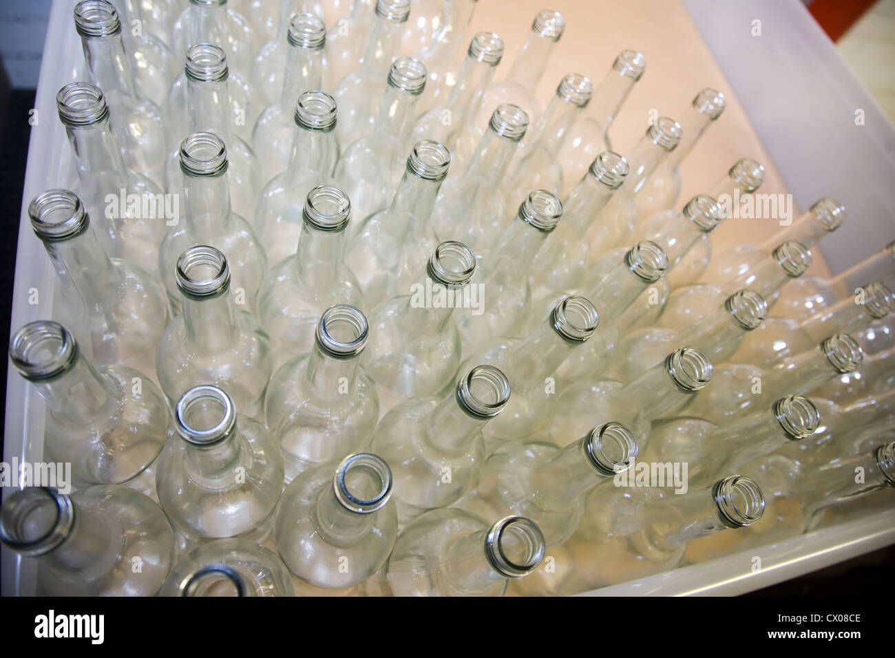 Empty clear glass bottles in box Stock Photo - Alamy