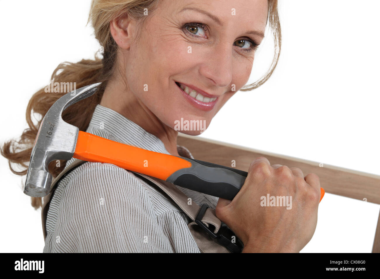 Woman with hammer Stock Photo - Alamy