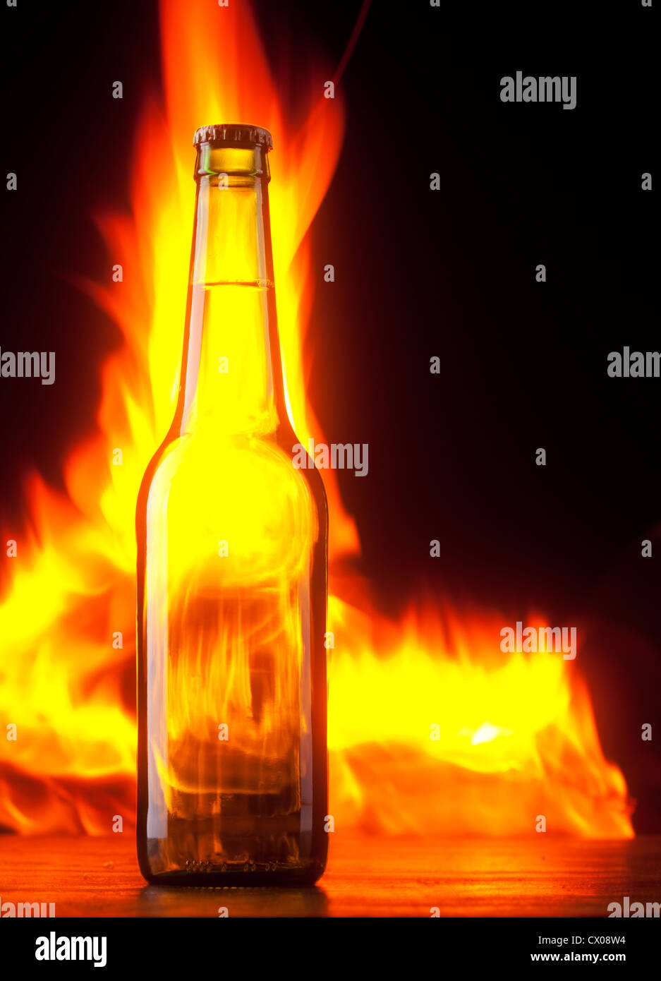 Beer bottle with color fire Stock Photo - Alamy