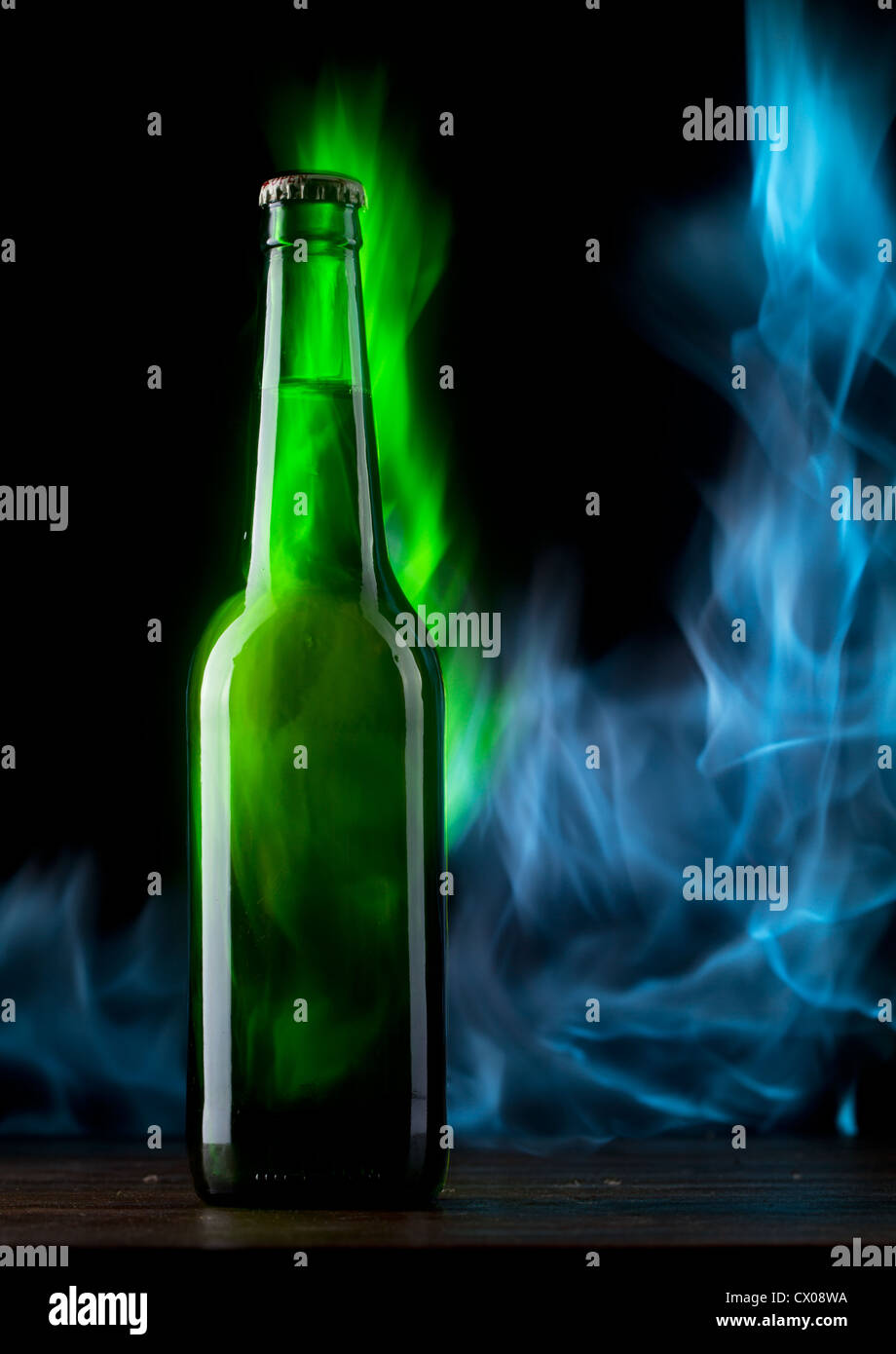 Beer bottle with color fire Stock Photo - Alamy