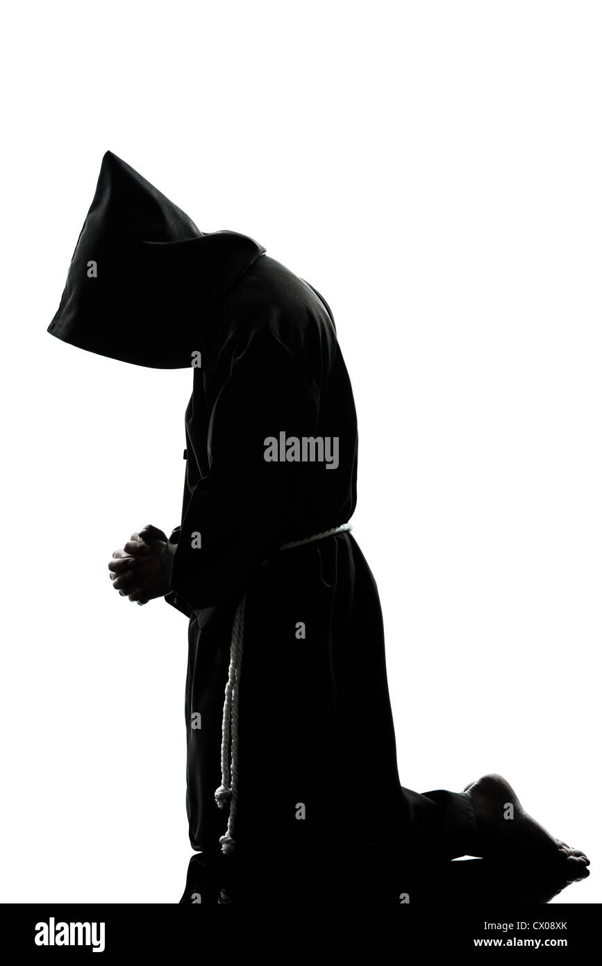 one caucasian man priest praying silhouette in studio isolated on white ...