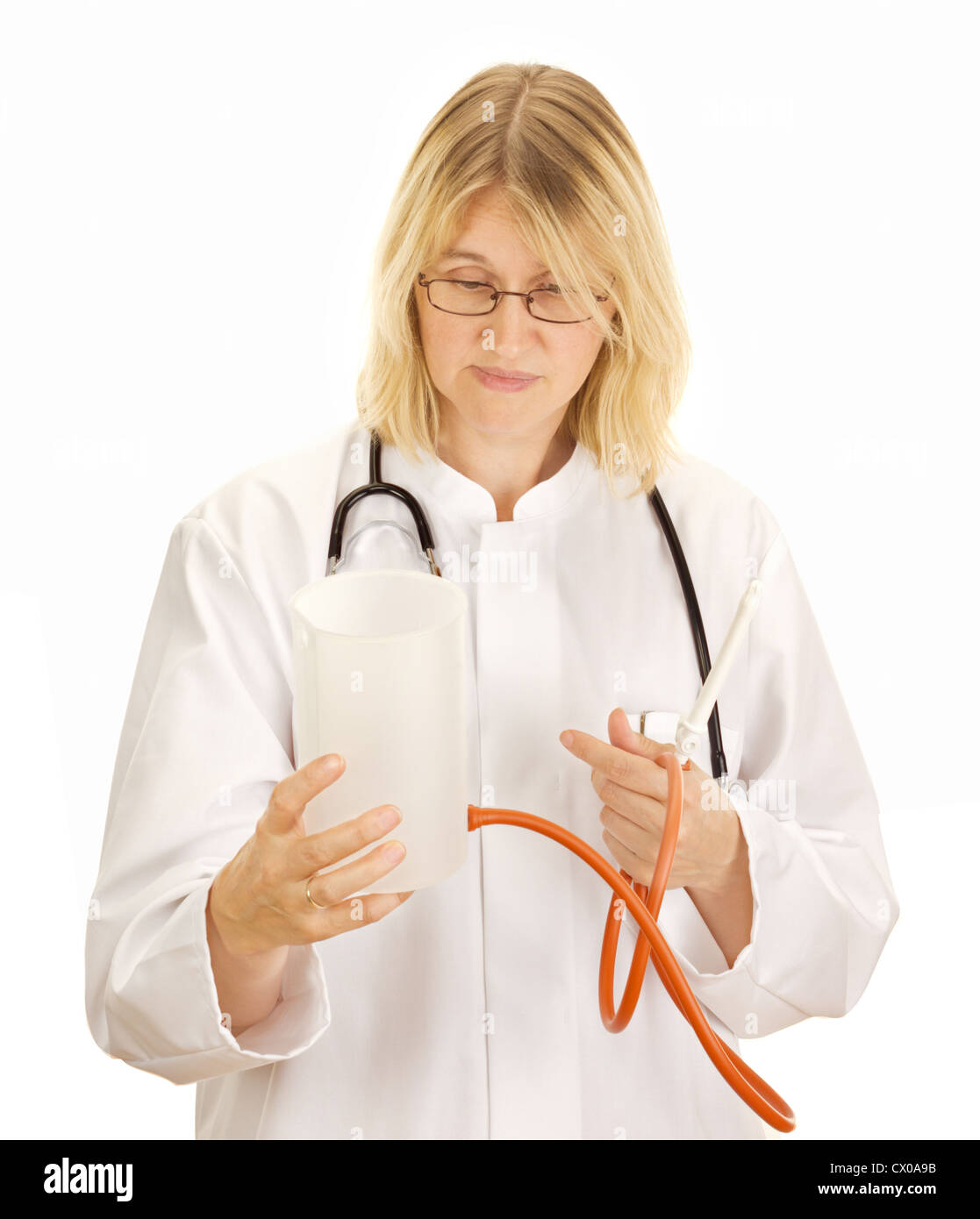 Medical doctor looking on a clyster Stock Photo - Alamy