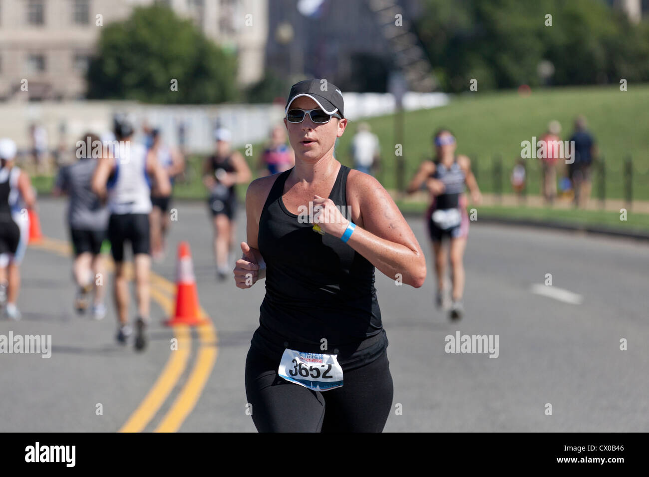 Female racer running in a marathon - USA Stock Photo - Alamy