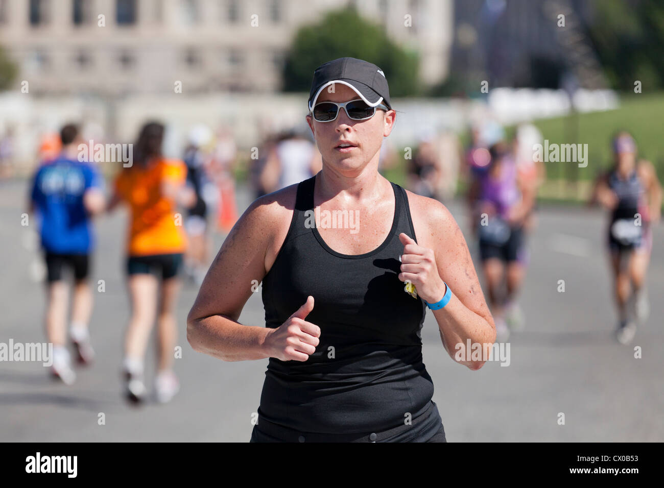 Female racer running in a marathon - USA Stock Photo - Alamy