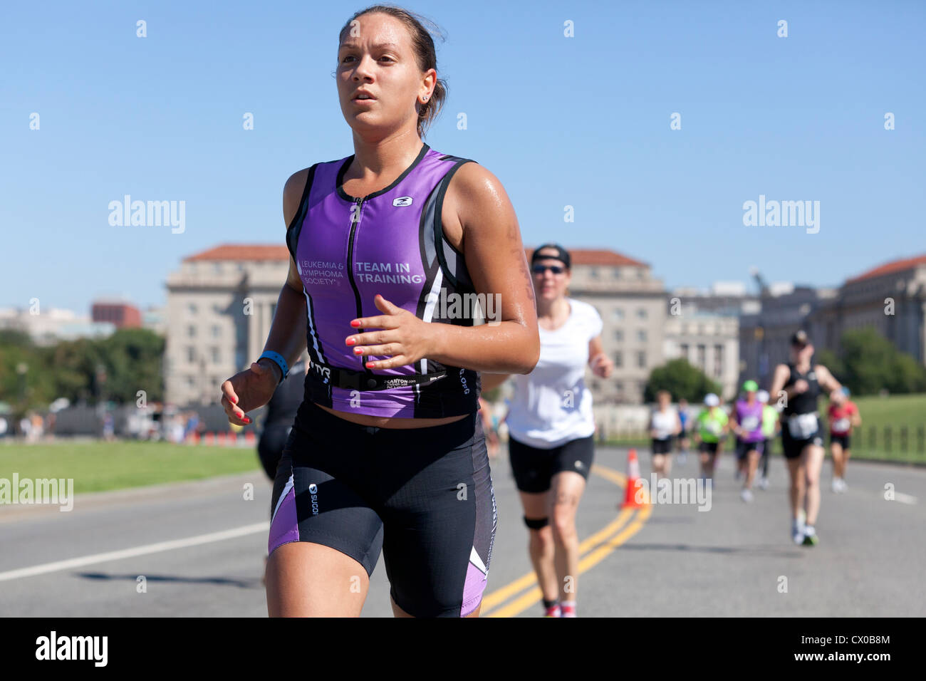 Female racer running in a marathon - USA Stock Photo - Alamy