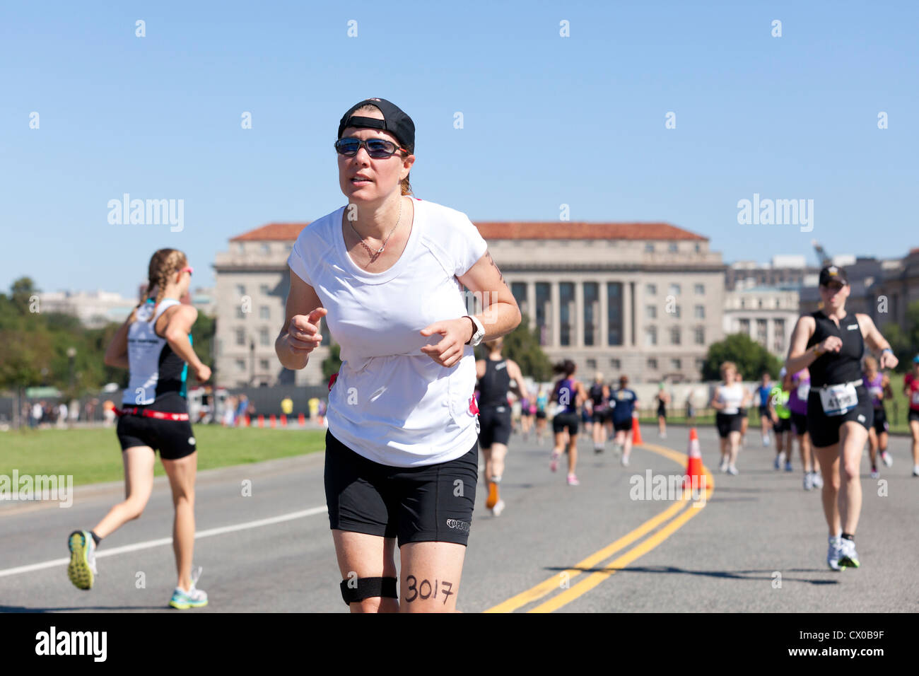 Female racer running in a marathon - USA Stock Photo - Alamy