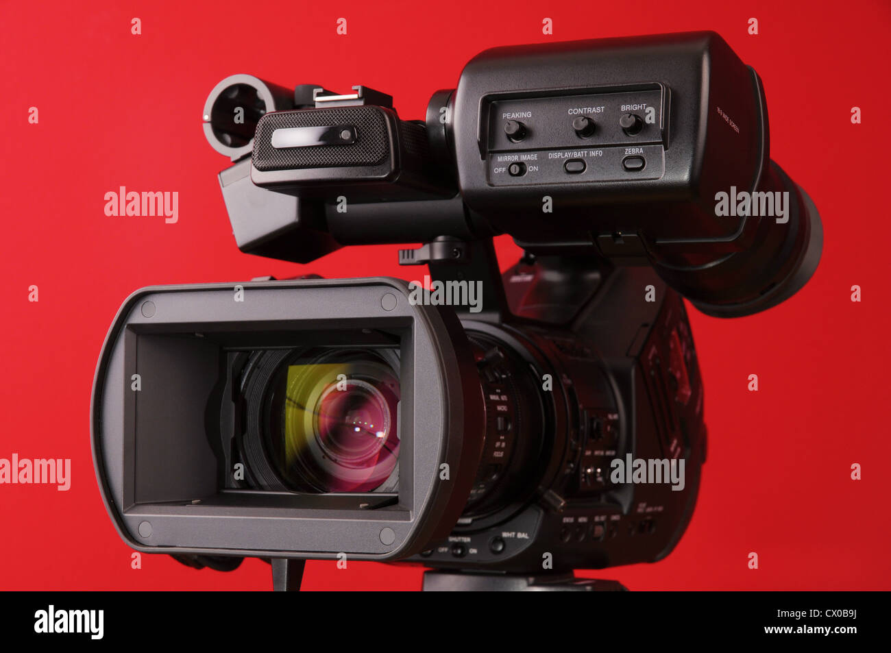 Video camera on red background Stock Photo - Alamy