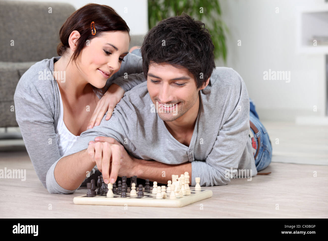 happy couple playing chess Stock Photo - Alamy