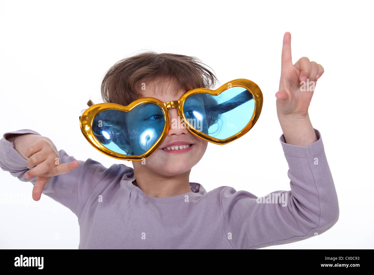 Young girl wearing funky glasses Stock Photo - Alamy