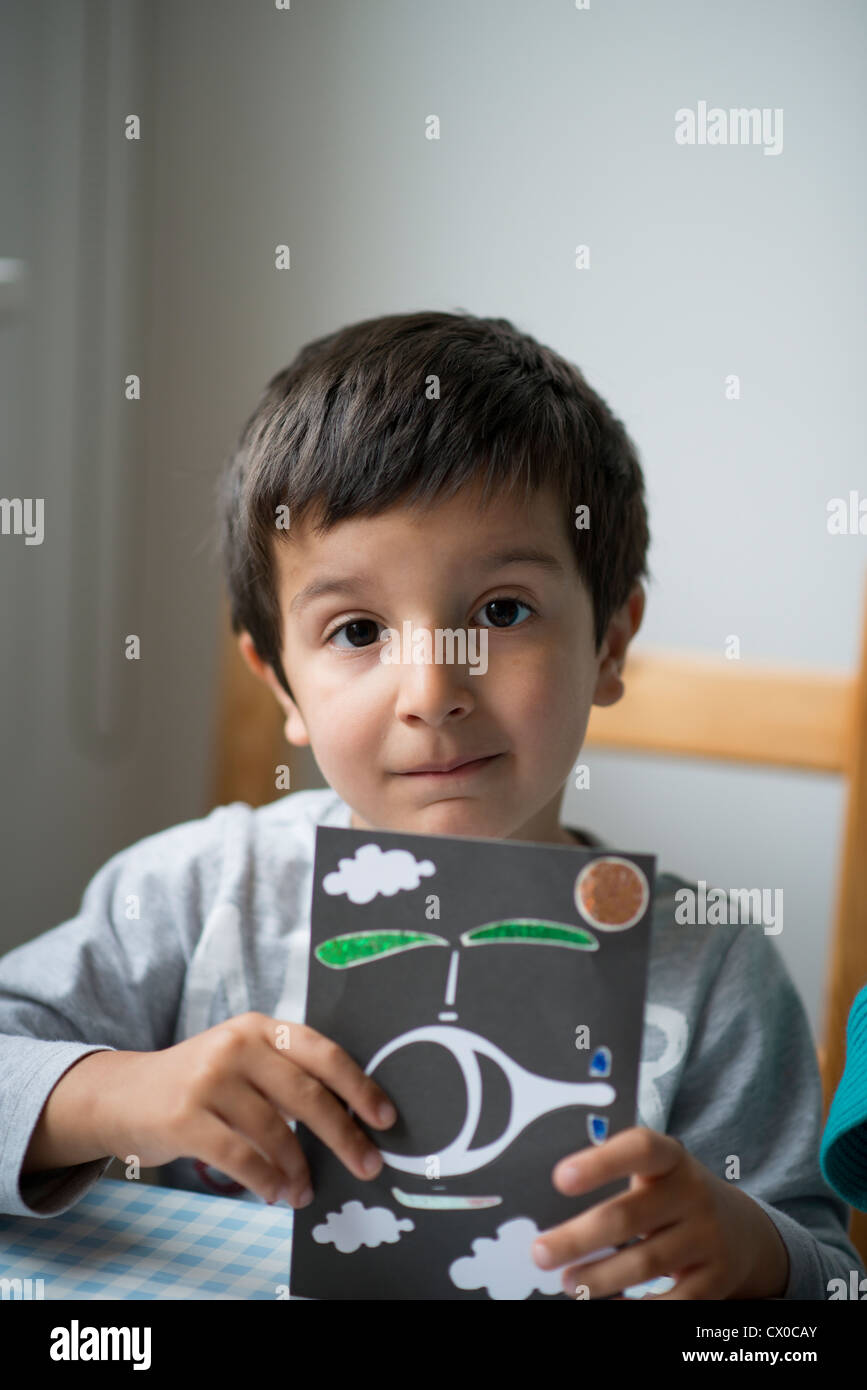 Boy holds handmade card Stock Photo - Alamy