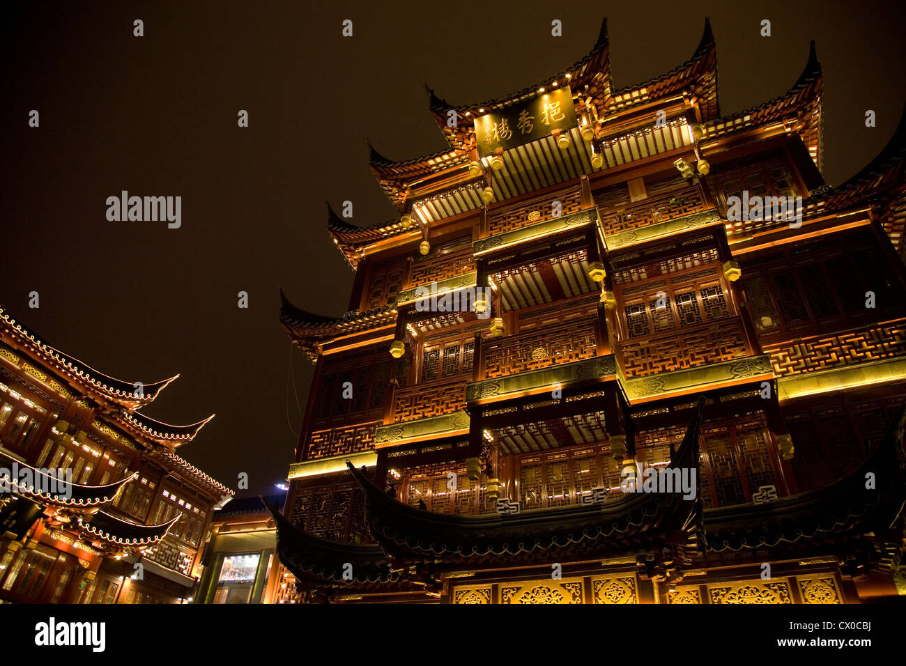 Traditional buildings lit up at night time in the Old Town, Nanshi, Shanghai, China Stock Photo ...