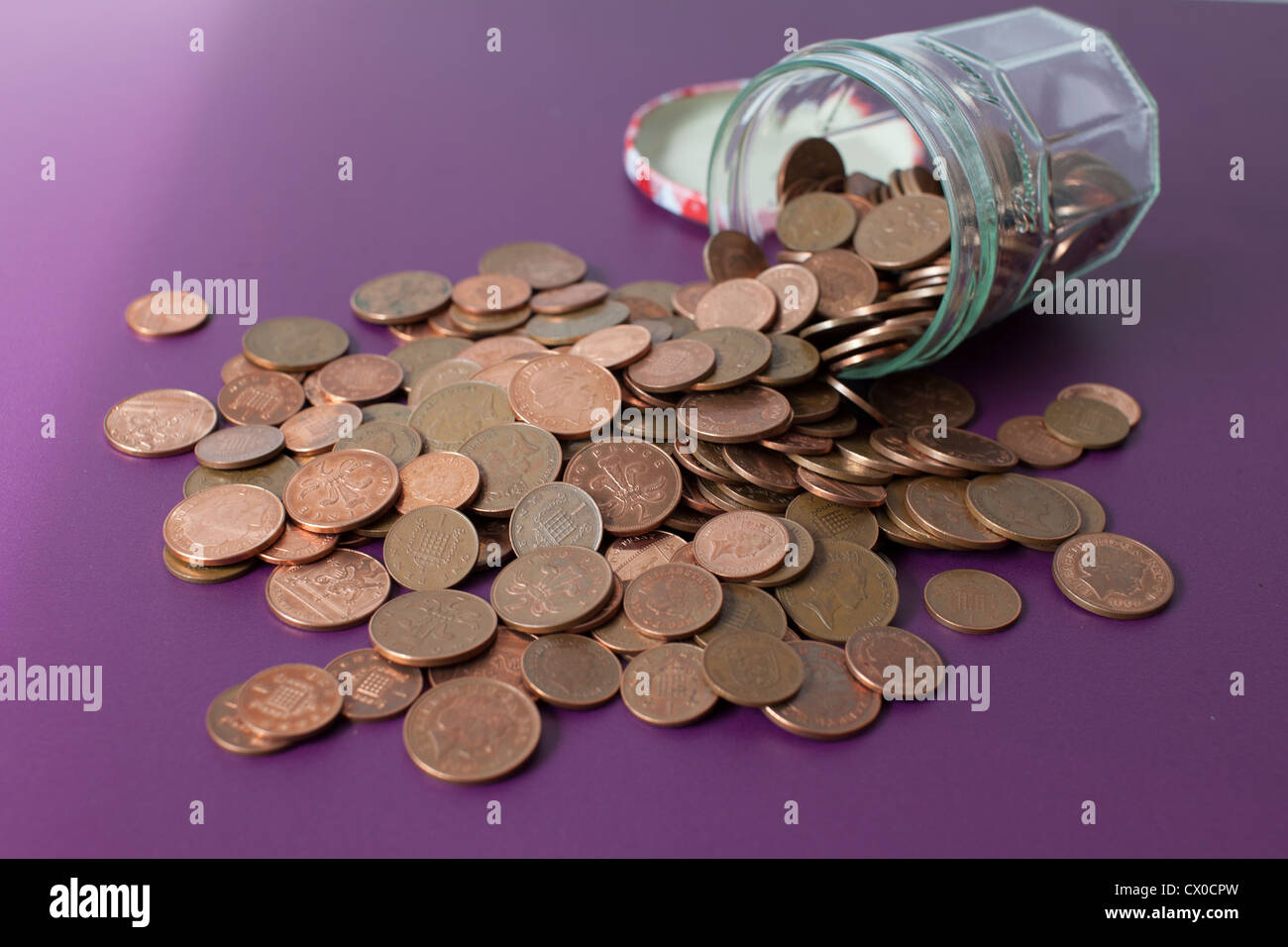 Jar full with pennies Stock Photo - Alamy