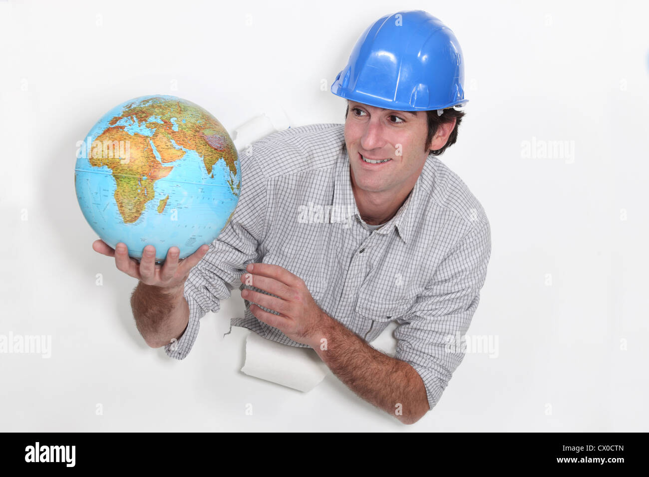 Construction worker holding a globe Stock Photo - Alamy