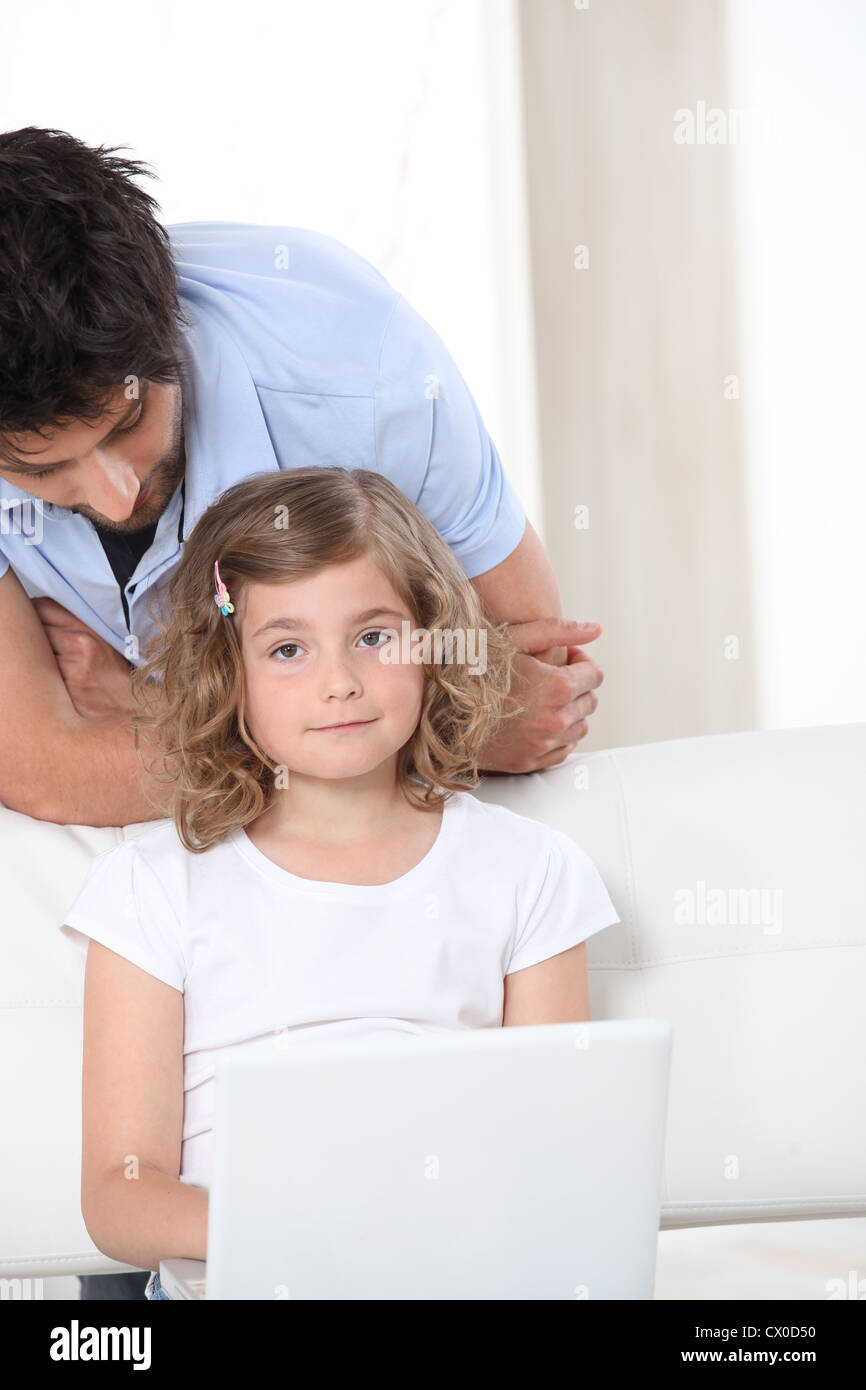 Father and daughter with a laptop Stock Photo - Alamy