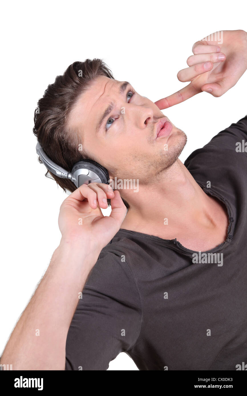 Man dancing with headphones, studio shot Stock Photo - Alamy