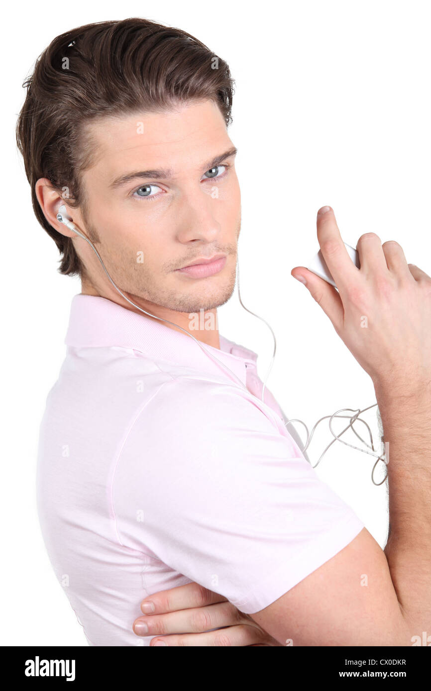 Man listening to music on an MP3 player Stock Photo - Alamy