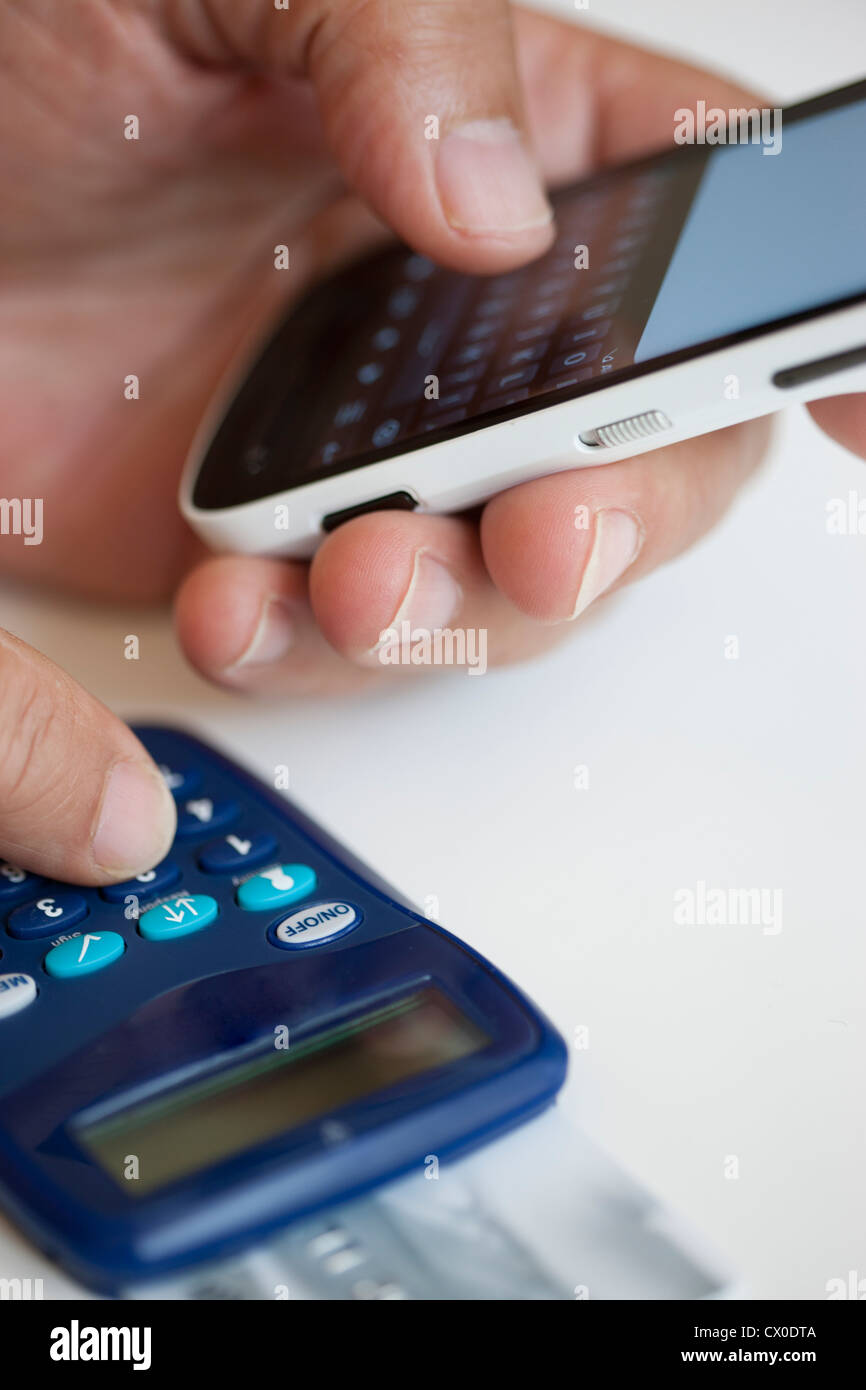 Man Holding an Internet Banking Card Reader and a Cell Phone Stock ...