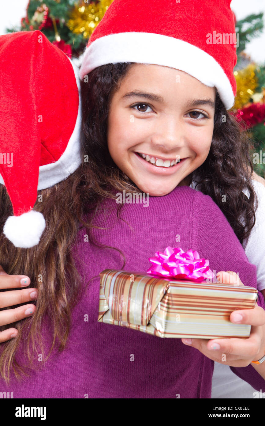 happy girl hugging mother after receiving her Christmas gift Stock ... happy girl hugging mother after receiving her Christmas gift Stock ...