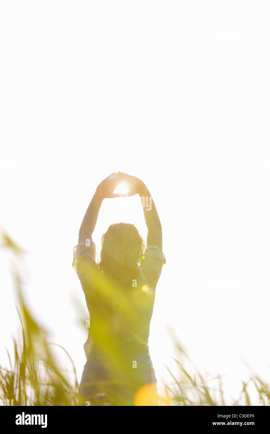 Rear view of a woman gesturing with her hands hi-res stock photography ...