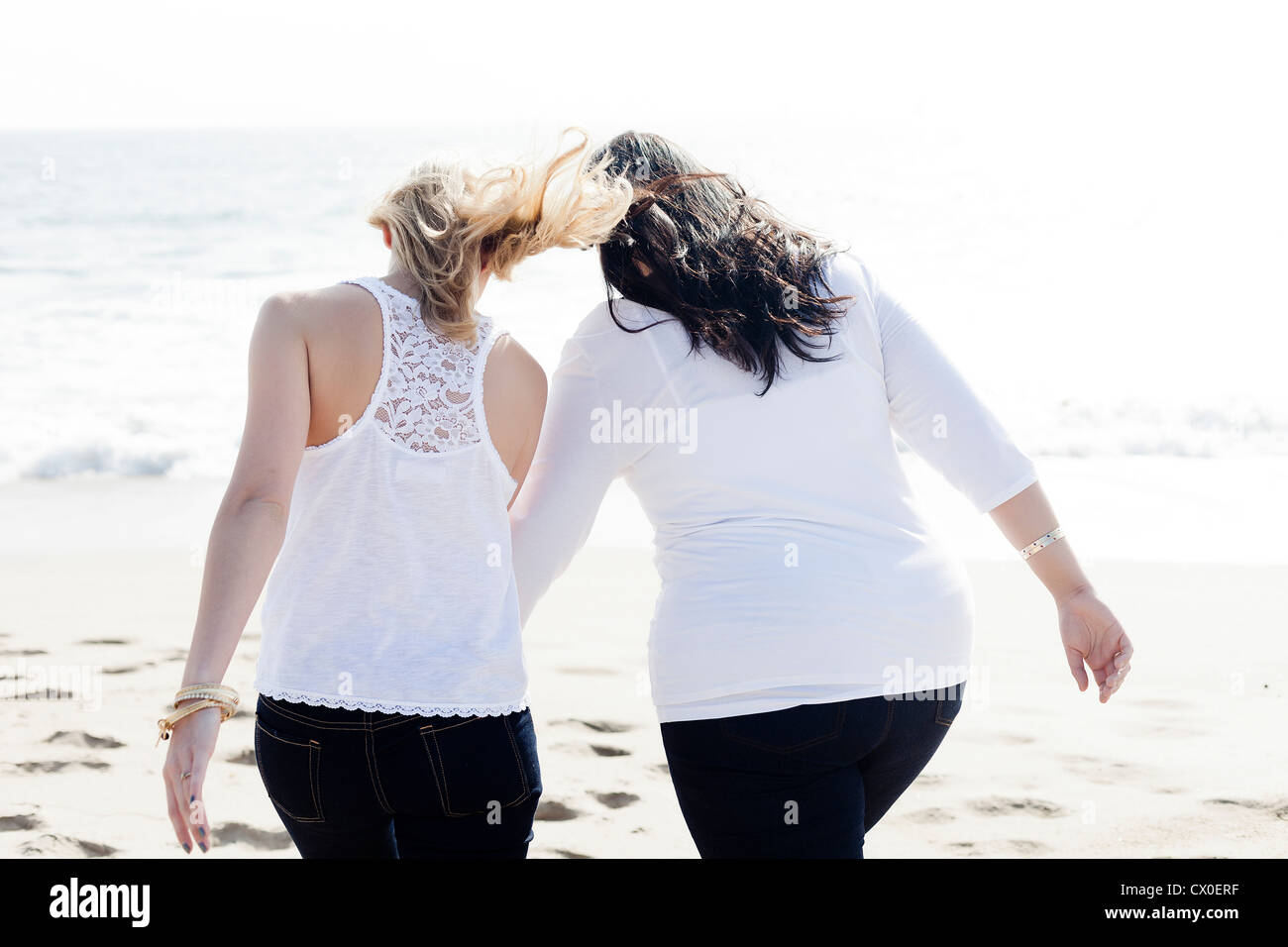 2 women walking back view hi-res stock photography and images - Alamy
