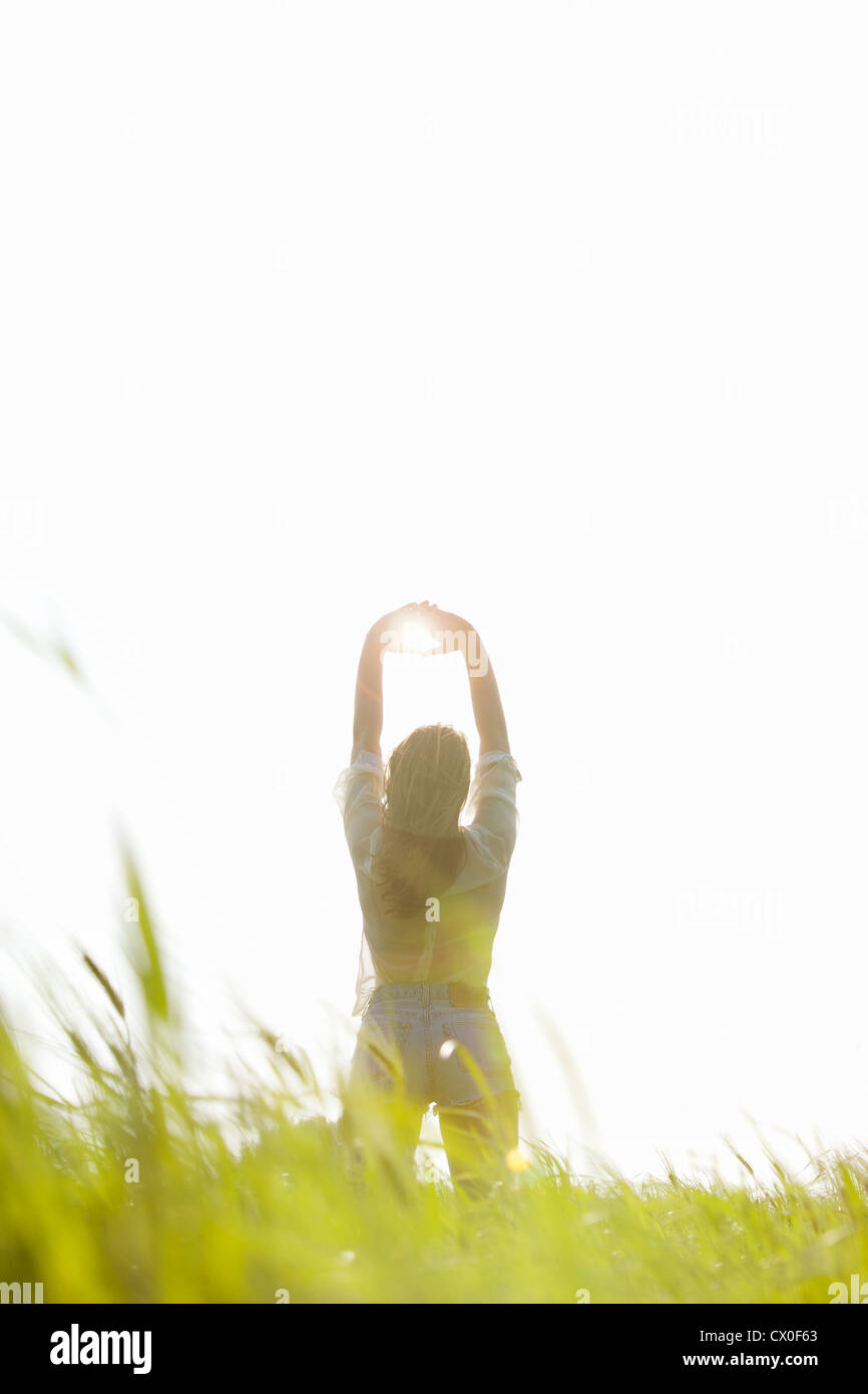 Rear view of a woman gesturing with her hands hi-res stock photography ...