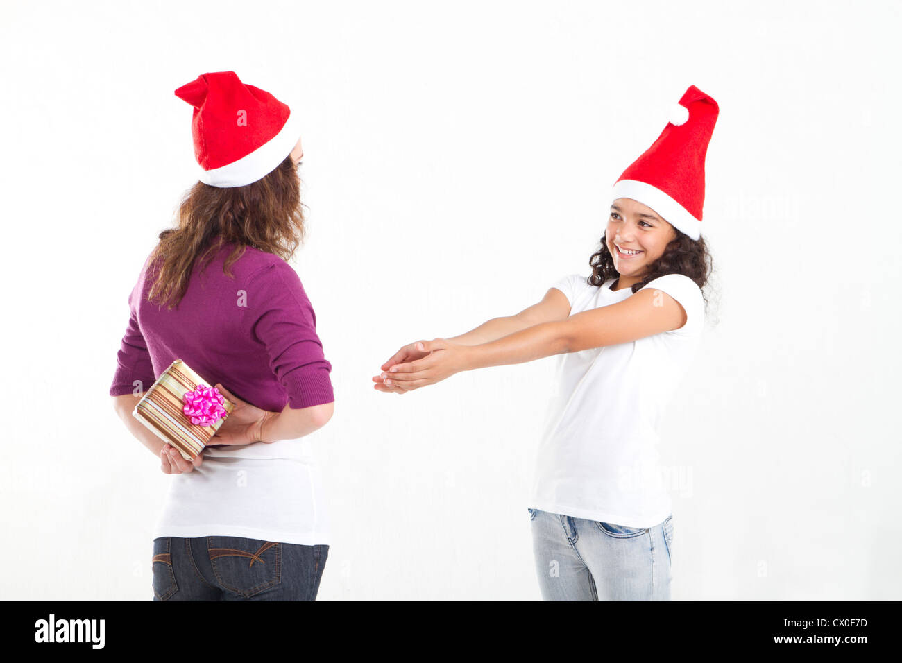 teen girl asking mother for christmas gift Stock Photo - Alamy