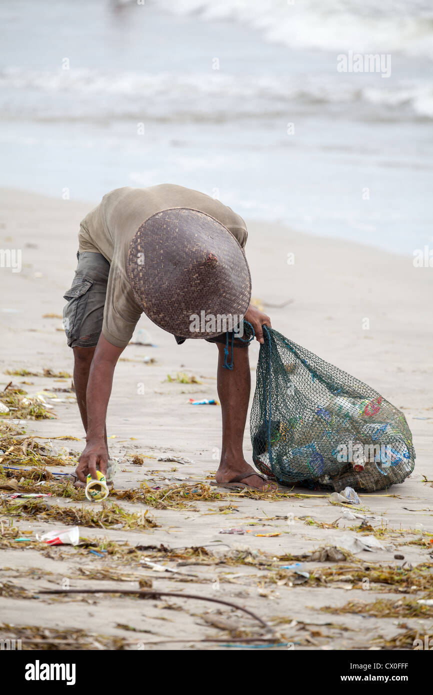 Garbage Collector on Kuta Beach in Bali Stock Photo - Alamy