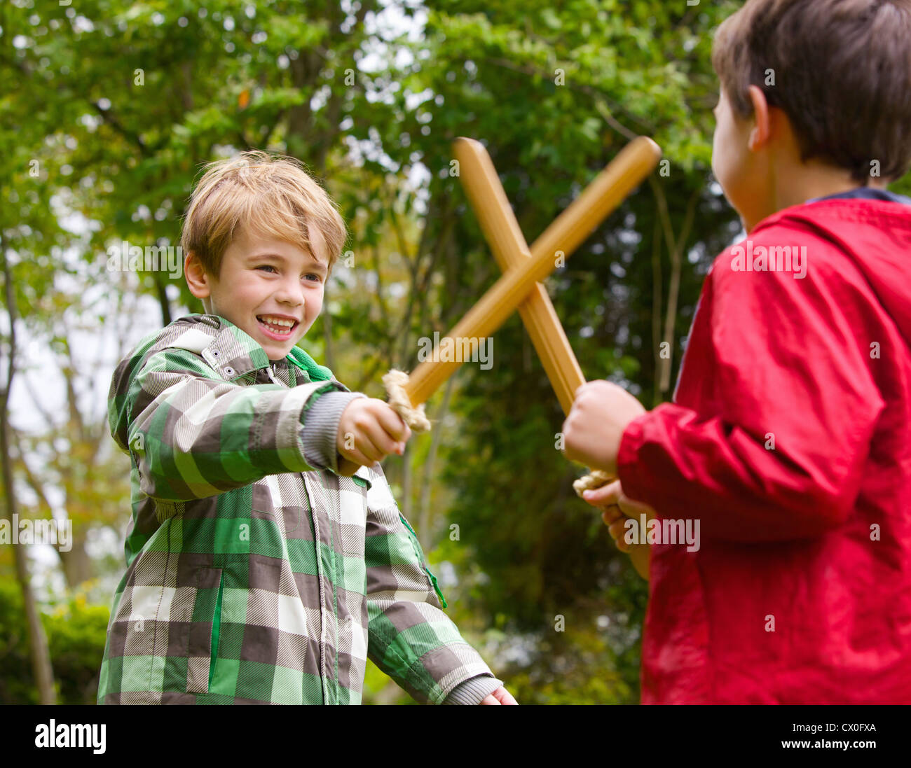 Two boys sword fighting hi-res stock photography and images - Alamy