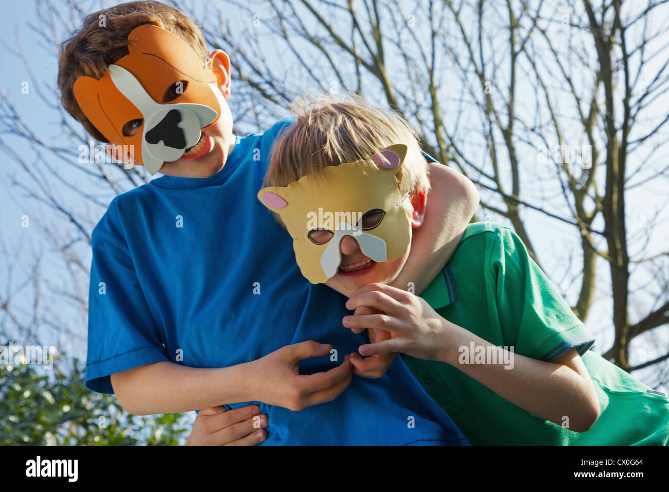 Two Boys Wearing Animal Masks Messing Around Stock Photo - Alamy