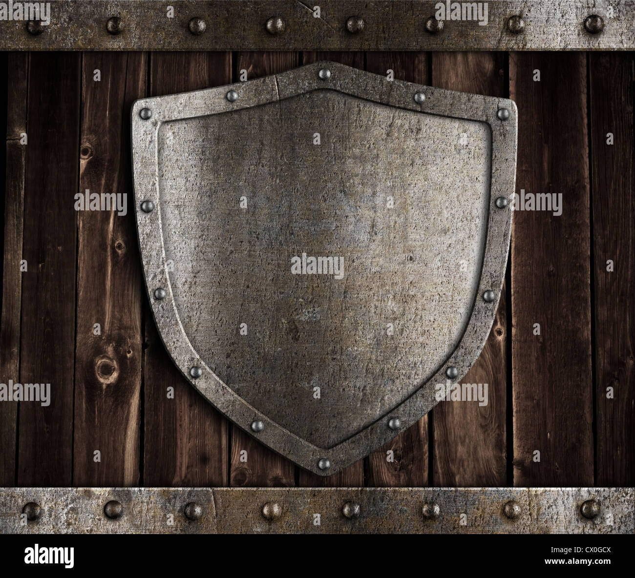 aged metal shield on wooden medieval gates Stock Photo - Alamy