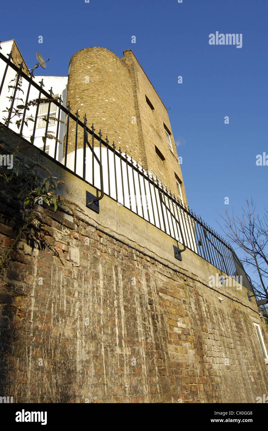 High wall and brick building towering to the sky Stock Photo - Alamy