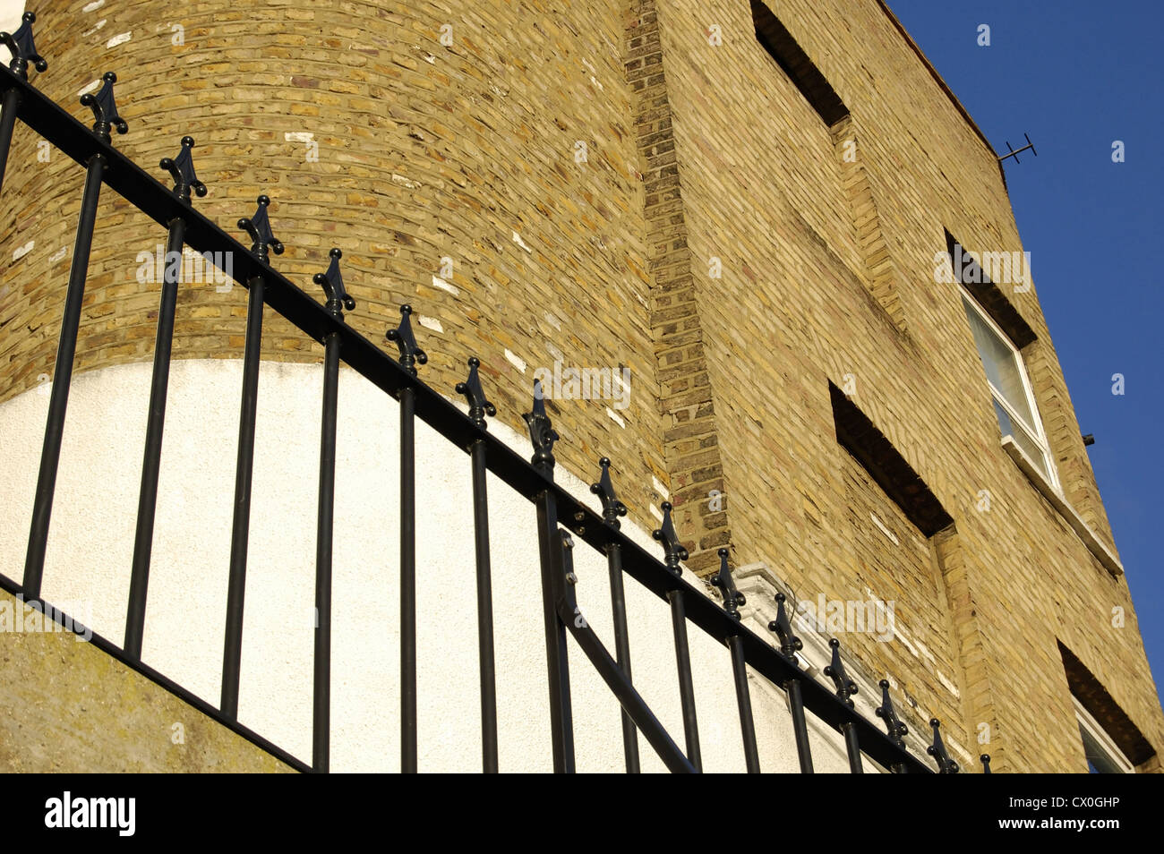 High wall and brick building towering to the sky Stock Photo - Alamy