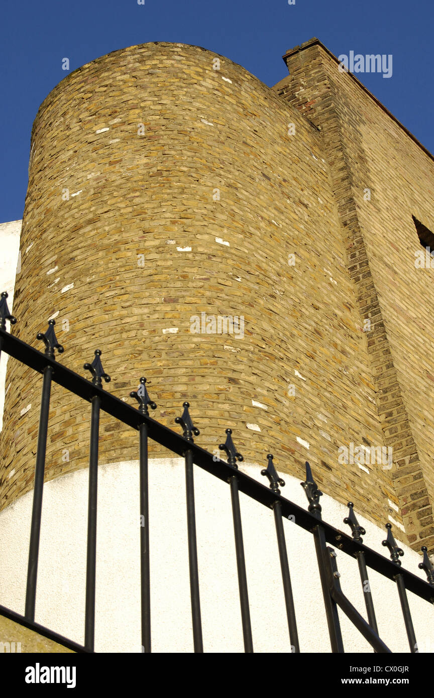 High wall and brick building towering to the sky Stock Photo - Alamy
