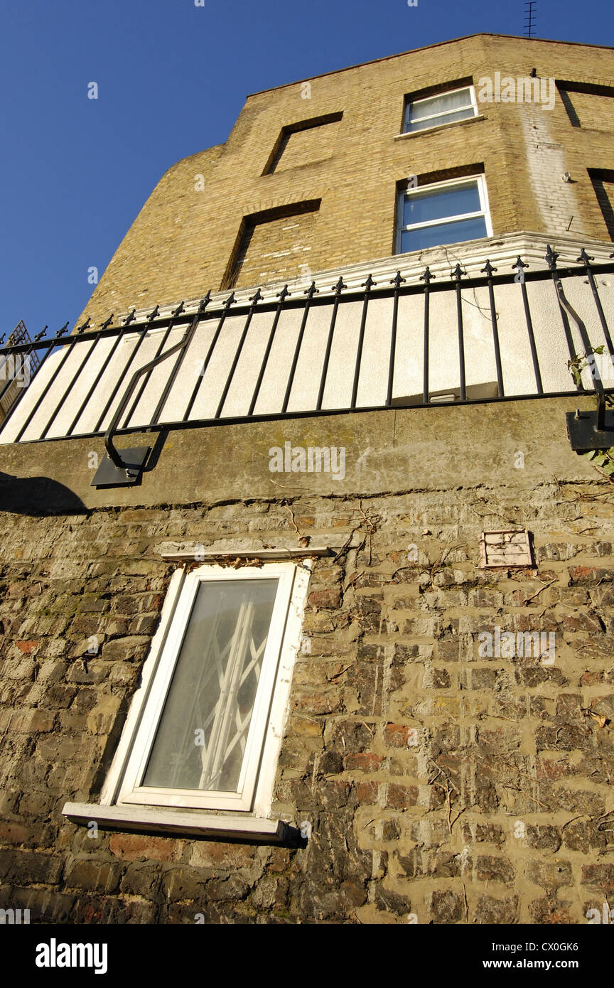 High wall and brick building towering to the sky Stock Photo - Alamy