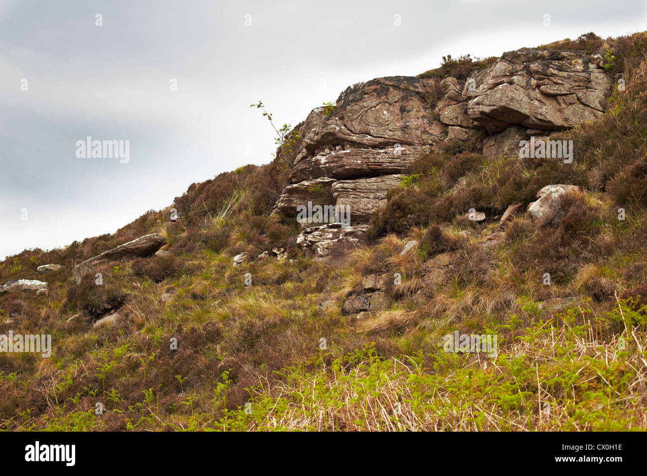 Strange face-like rock formations on the hillside overlooking Lower ...