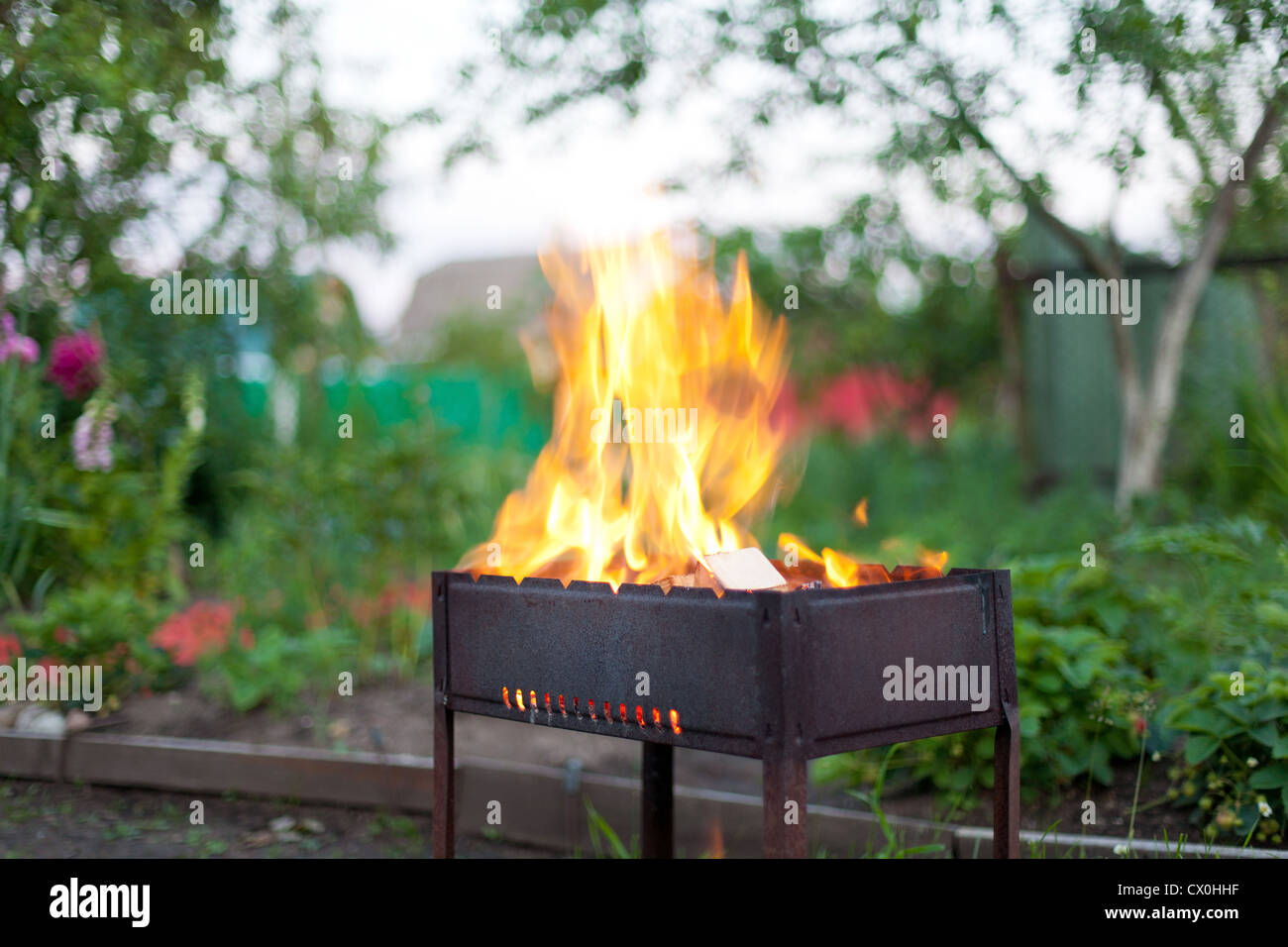Fire in barbecue, outdoor Stock Photo - Alamy
